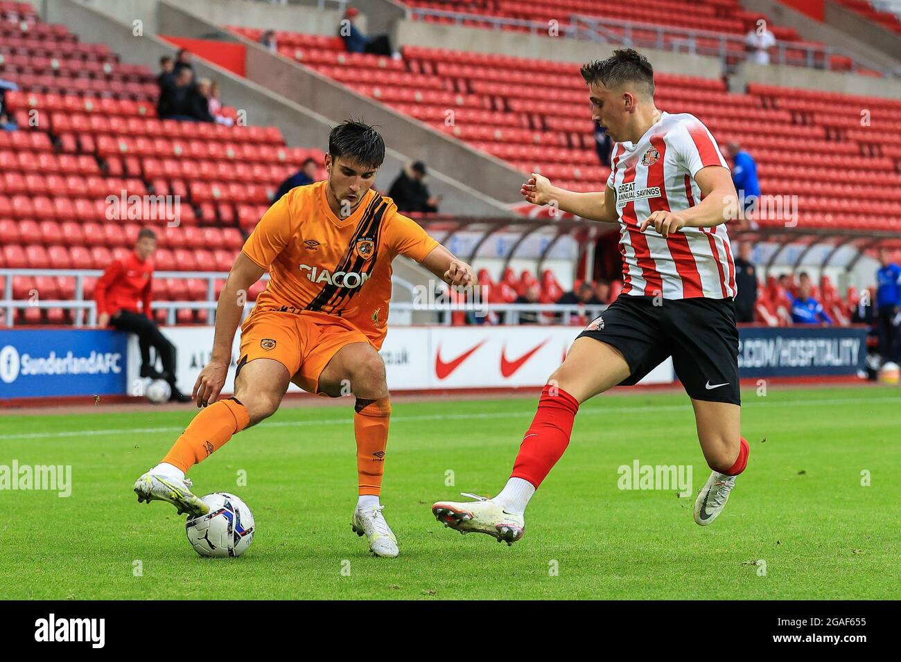 Ryan Longman #16 of Hull City controls the ball under pressure from Dan ...