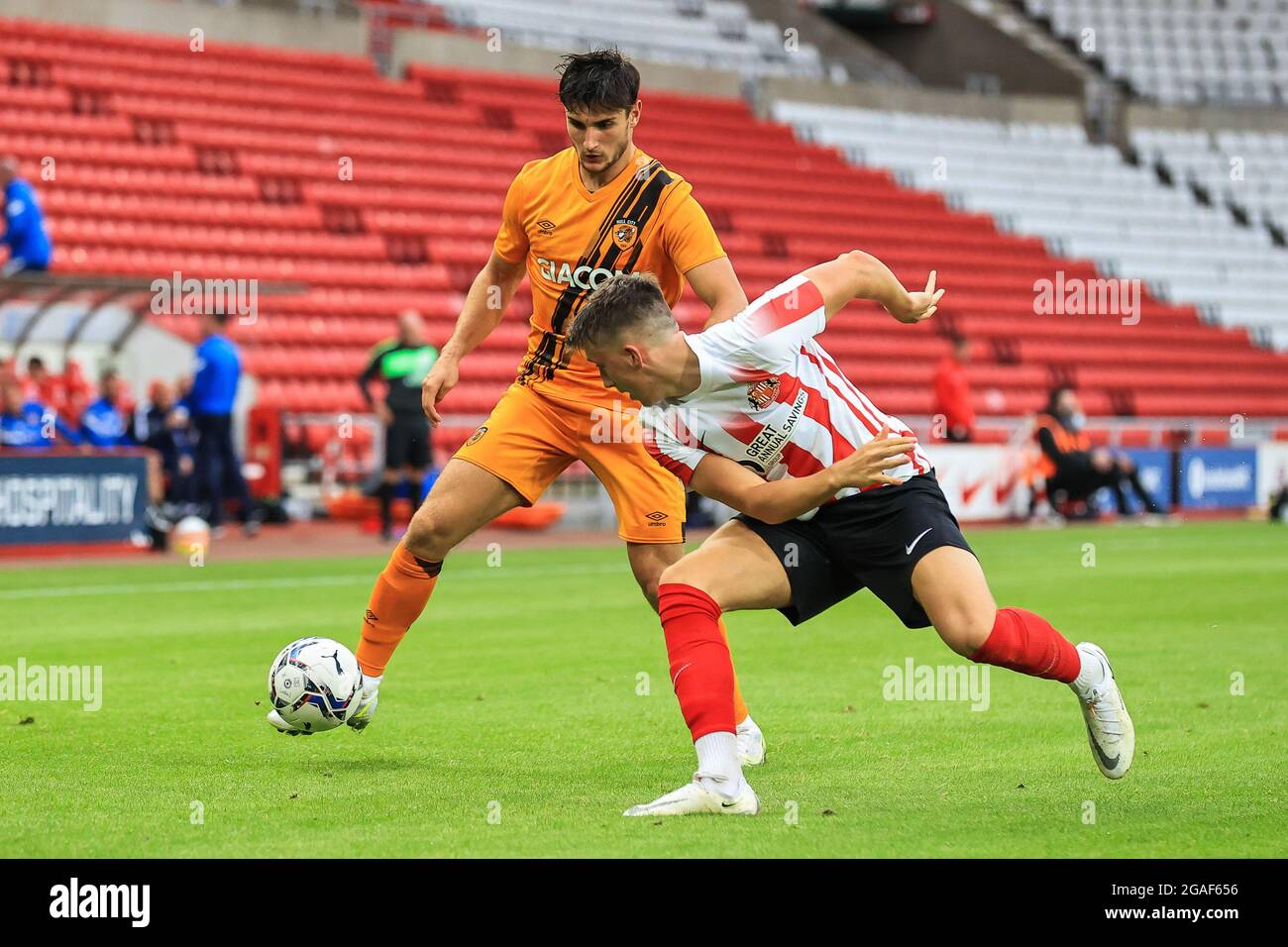 Ryan Longman #16 of Hull City controls the ball under pressure from Dan ...