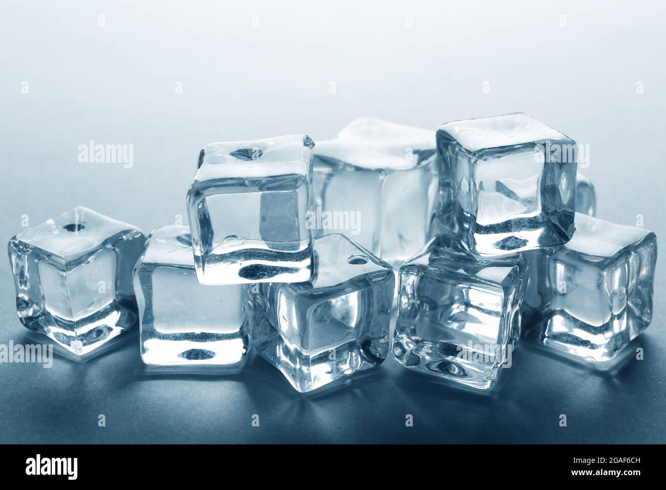 Perfect clear ice cubes on grey background Stock Photo - Alamy