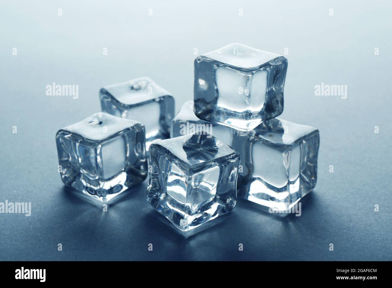 Perfect clear ice cubes on grey background Stock Photo - Alamy