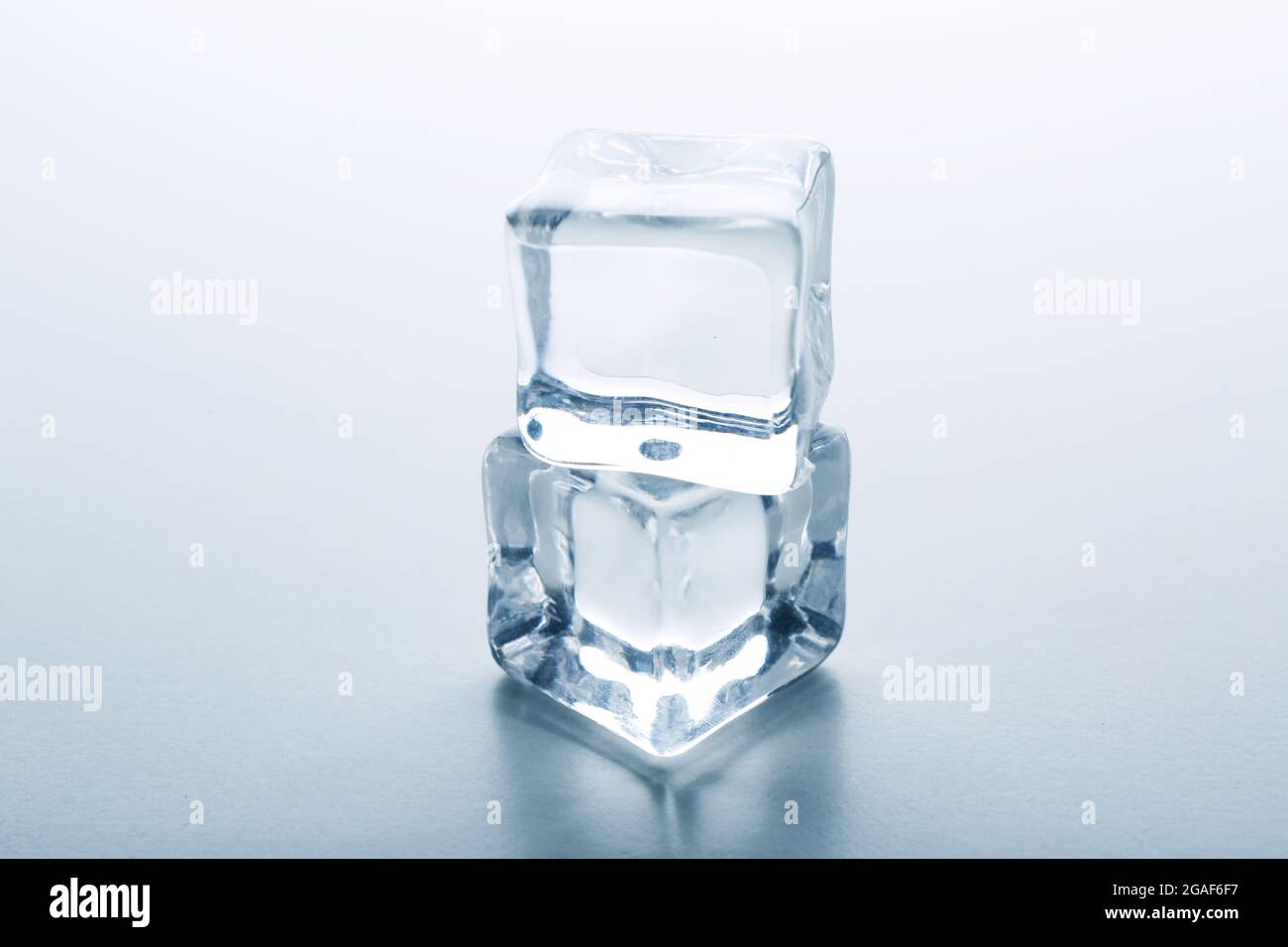 Perfect clear ice cubes on grey background Stock Photo - Alamy