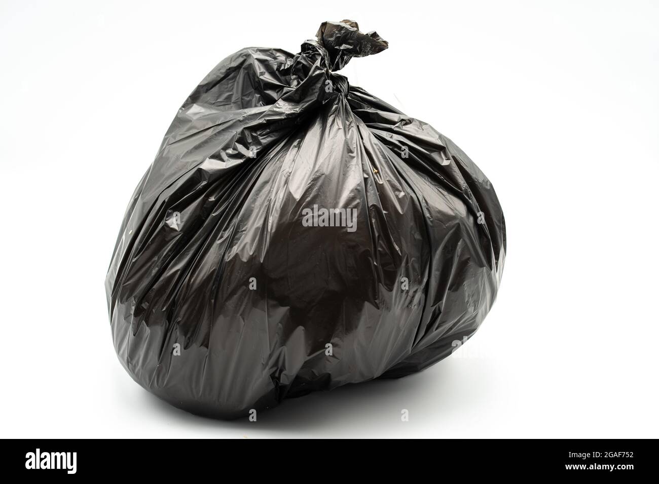 Full trash bag isolated on a white background Stock Photo - Alamy