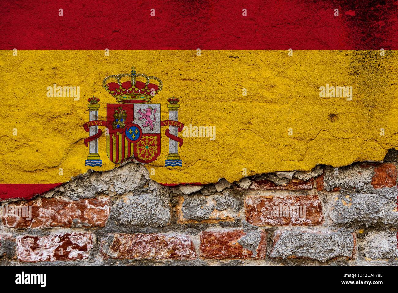 Graphic Concept with a Flag of Spain painted on a damaged brick wall ...