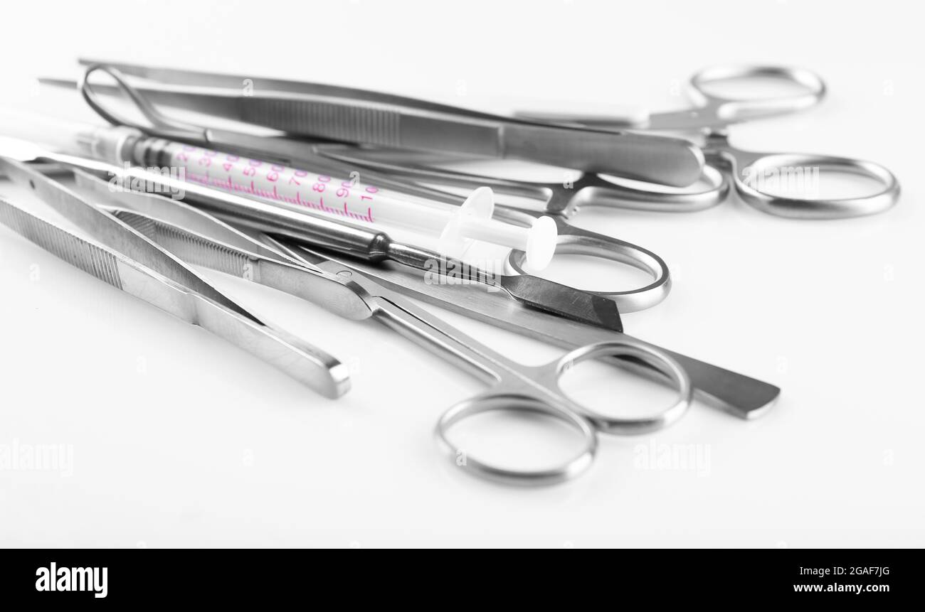Surgery instruments isolated on white Stock Photo - Alamy