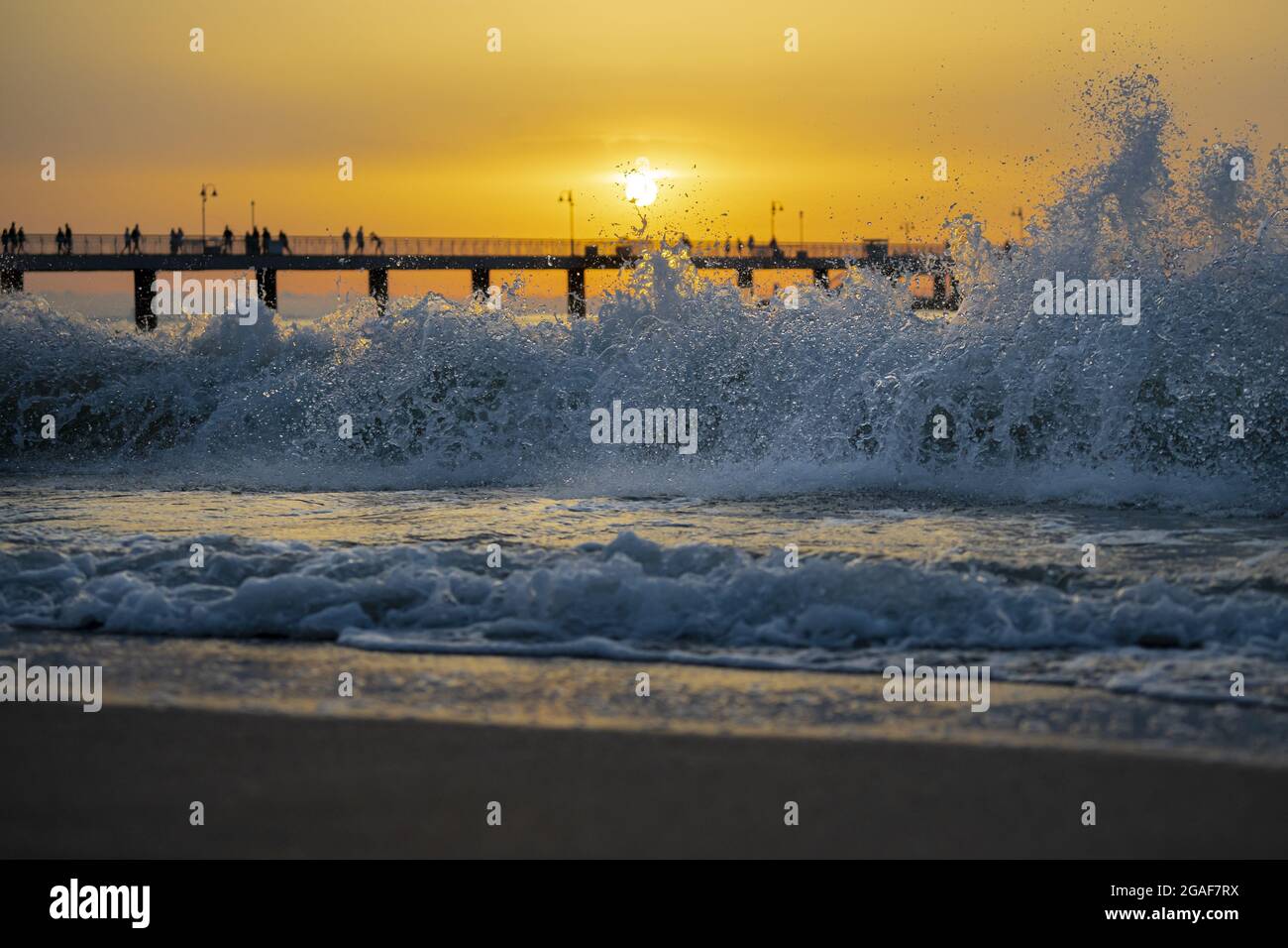 Beautiful sunset at sea with raging waves Stock Photo - Alamy