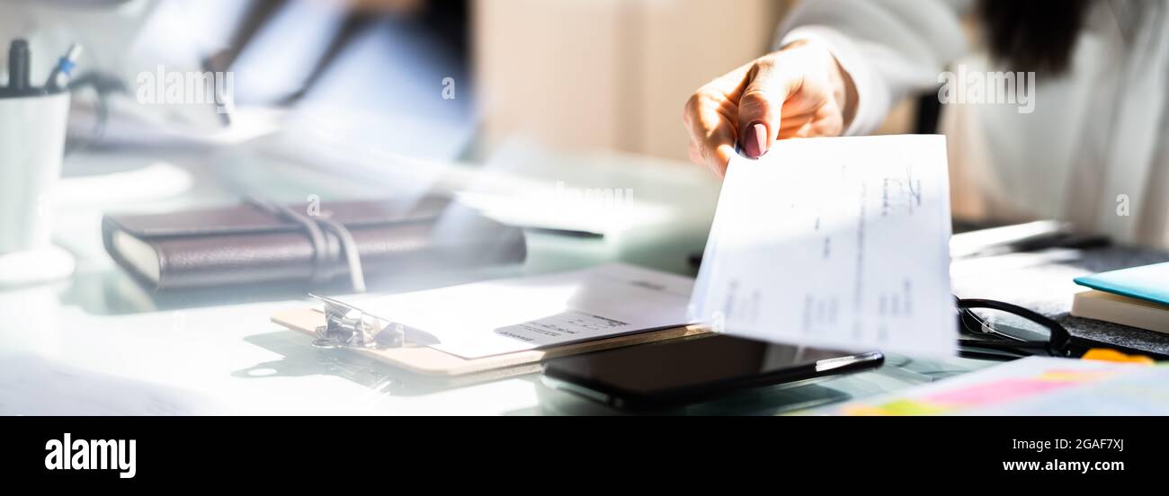 Giving Paycheck Or Payroll Cheque. Rent Check Pay Stock Photo - Alamy