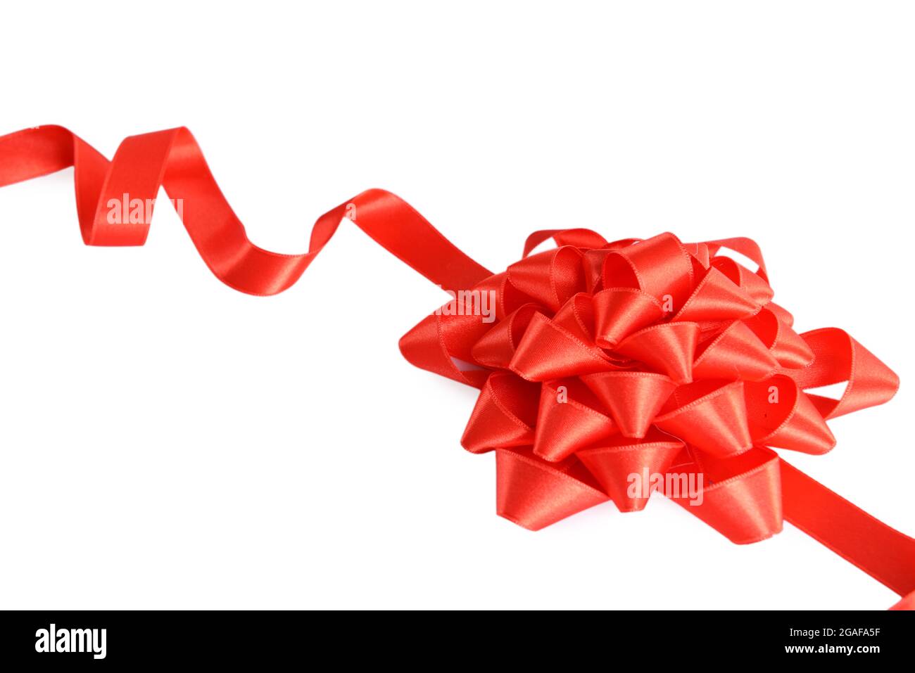 Red bow with curved ribbon isolated on white background Stock Photo - Alamy
