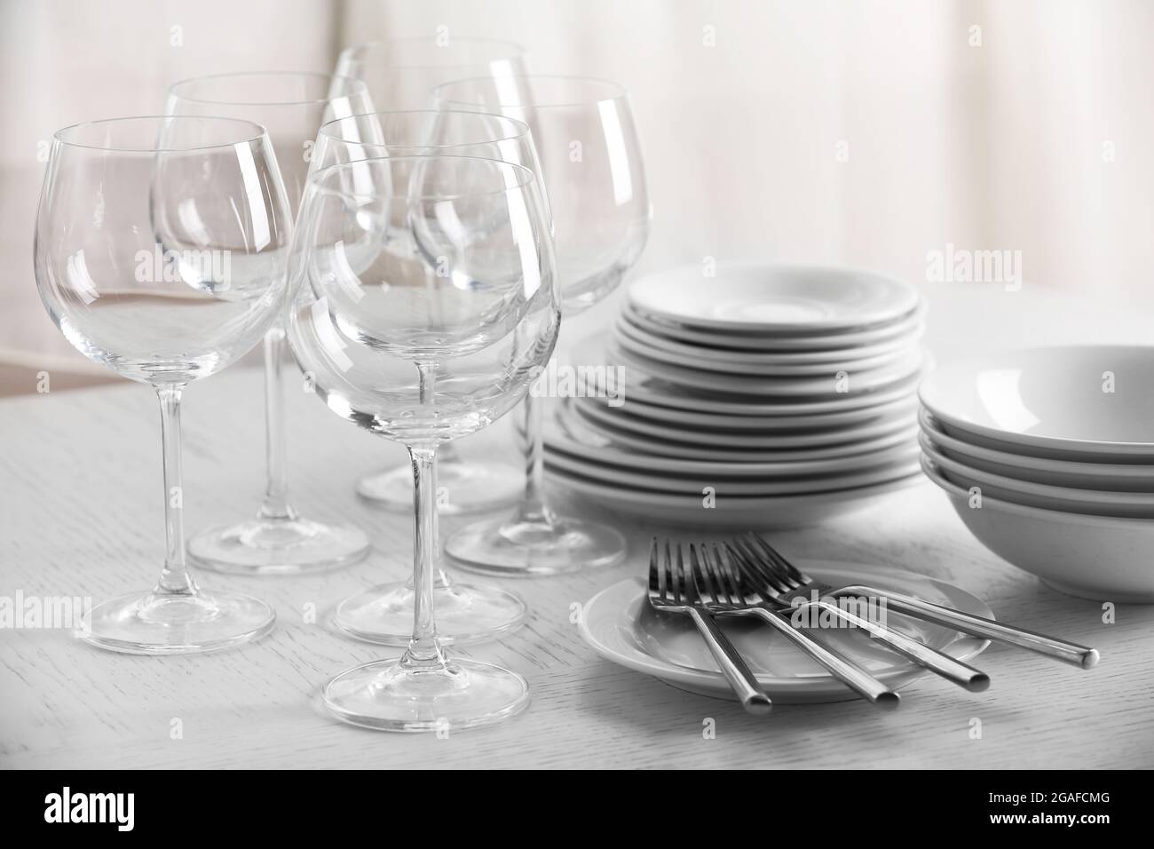 Clean dishes on the table Stock Photo - Alamy
