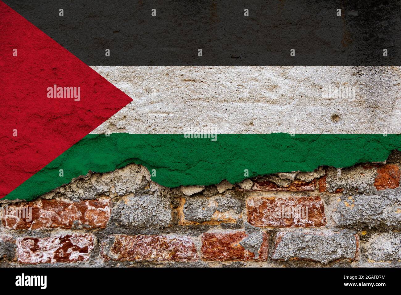 Graphic Concept with a Flag of Palestine painted on a damaged brick ...