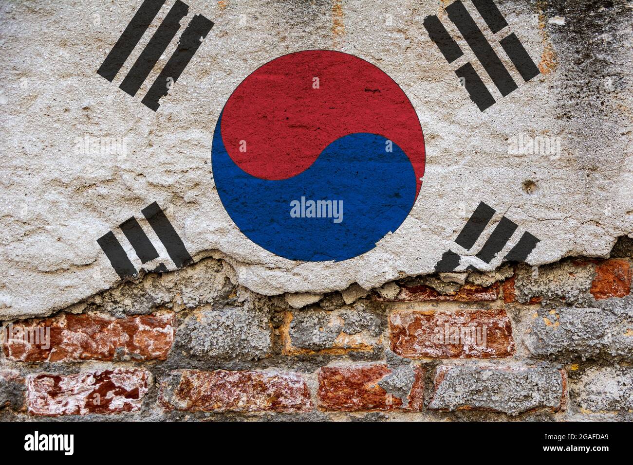 Graphic Concept with a Flag of South Korea painted on a damaged brick ...
