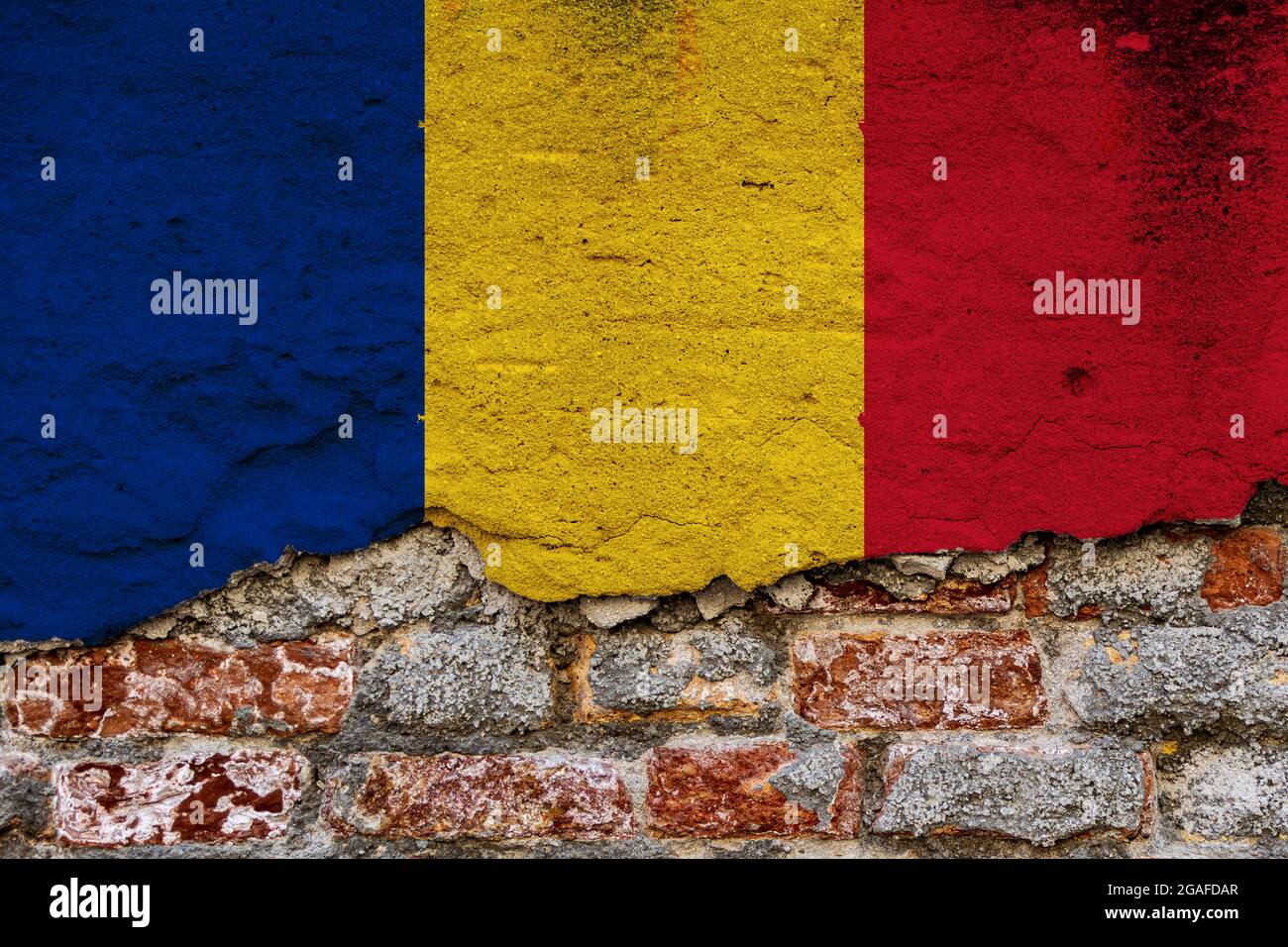 Graphic Concept with a Flag of Romania painted on a damaged brick wall ...