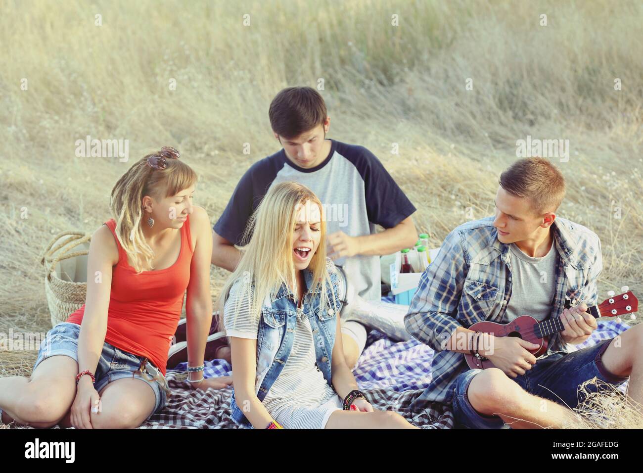 Joyful smiling friends relaxing in the forest outdoors Stock Photo - Alamy