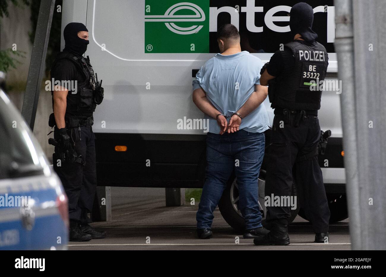 Berlin, Germany. 30th July, 2021. Police officers stand next to a ...