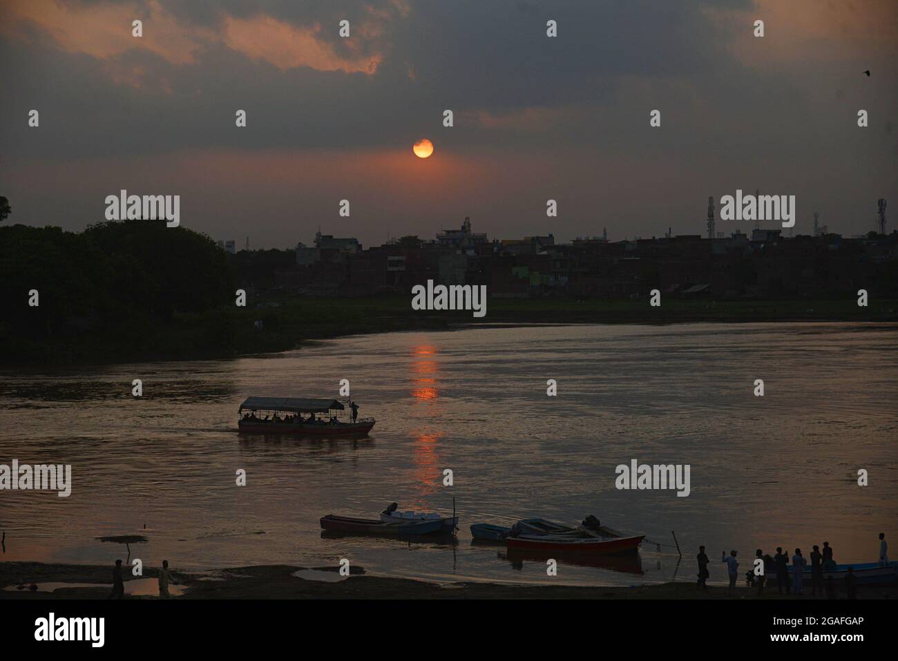 Lahore, Pakistan. 30th July, 2021. Pakistani people enjoying in Ravi ...