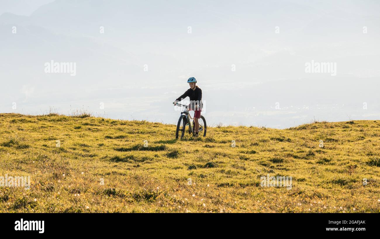 Girl mountain biker cycle downhill hi-res stock photography and images ...
