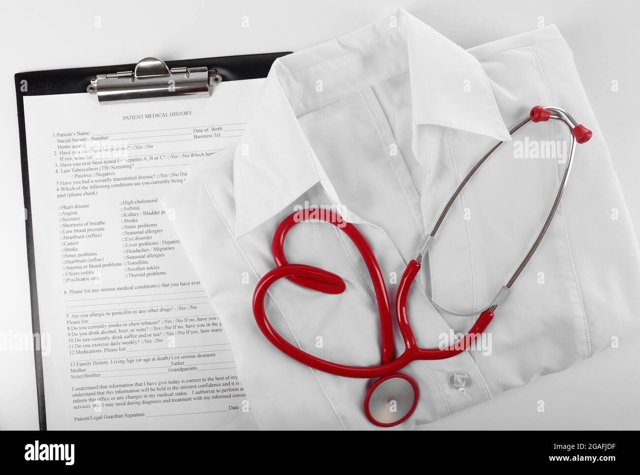 Stethoscope, medical record and uniform on white background Stock Photo ...