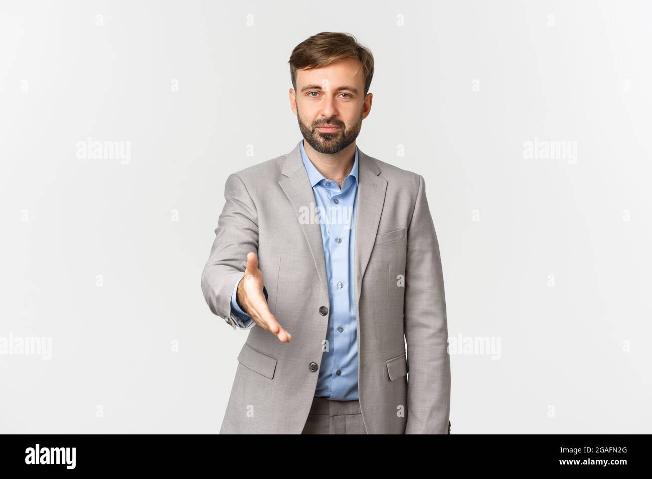 Portrait of confident businessman with beard, wearing grey suit ...
