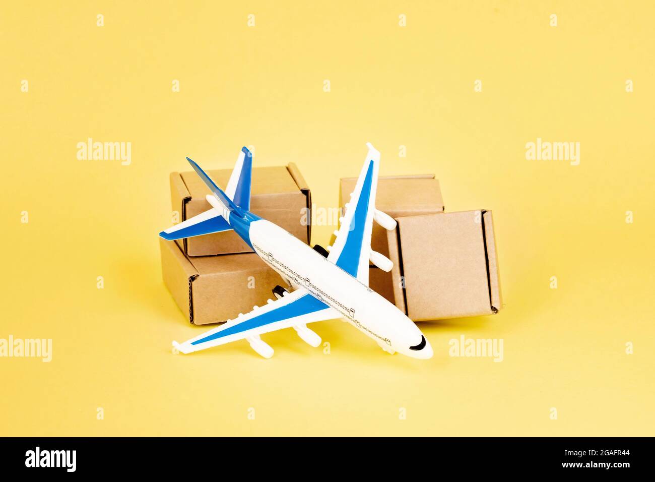 Airplane and stack of cardboard boxes. concept of air cargo and parcels ...