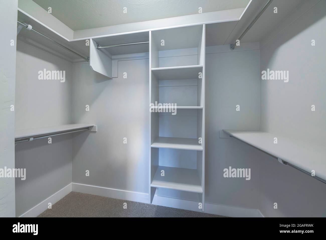 Empty small windowless walk in closet with open wardrobe Stock Photo ...