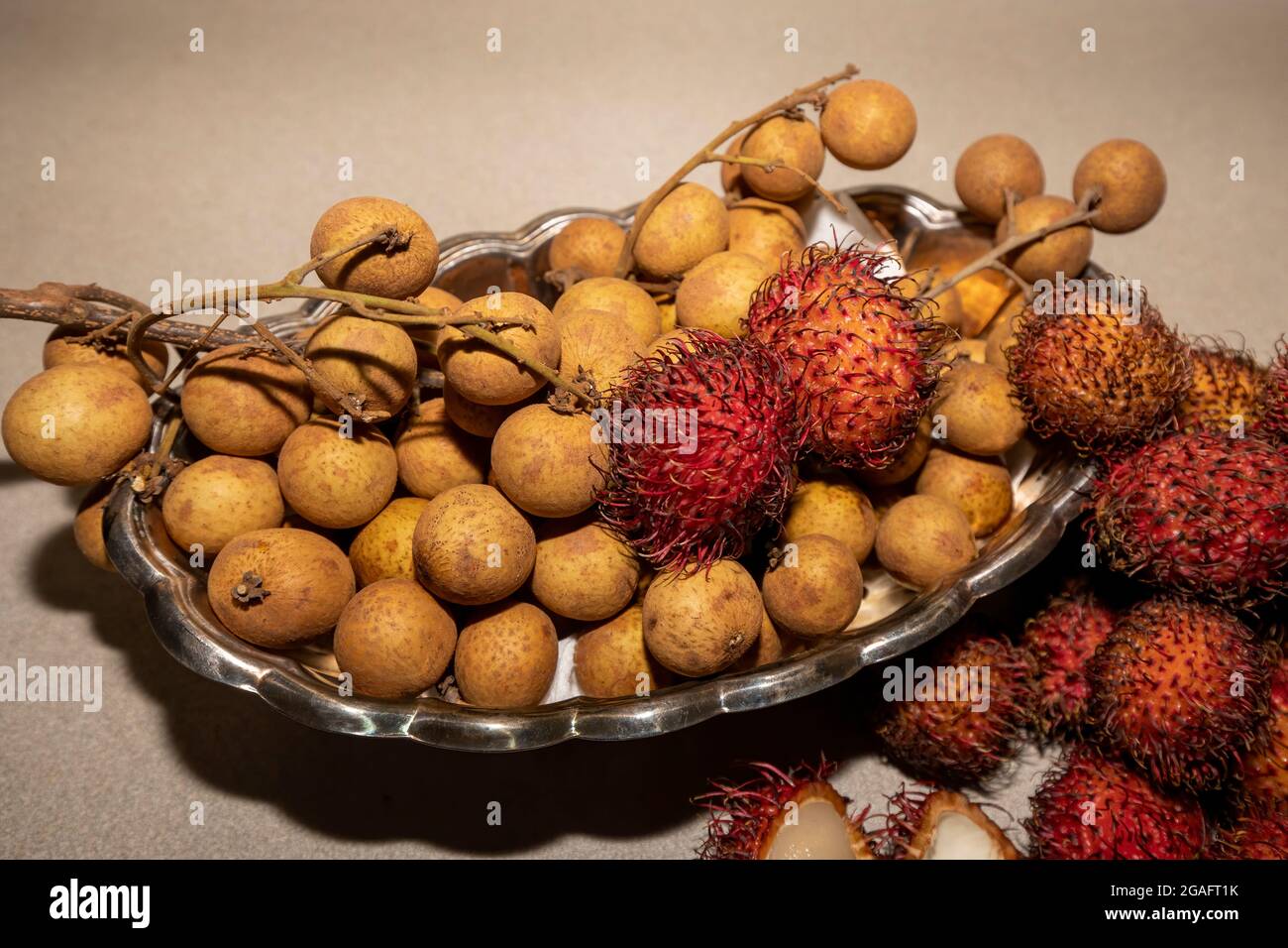 Exotic fruits Chom Chom (Rambutan) and Dimocarpus longan, commonly ...