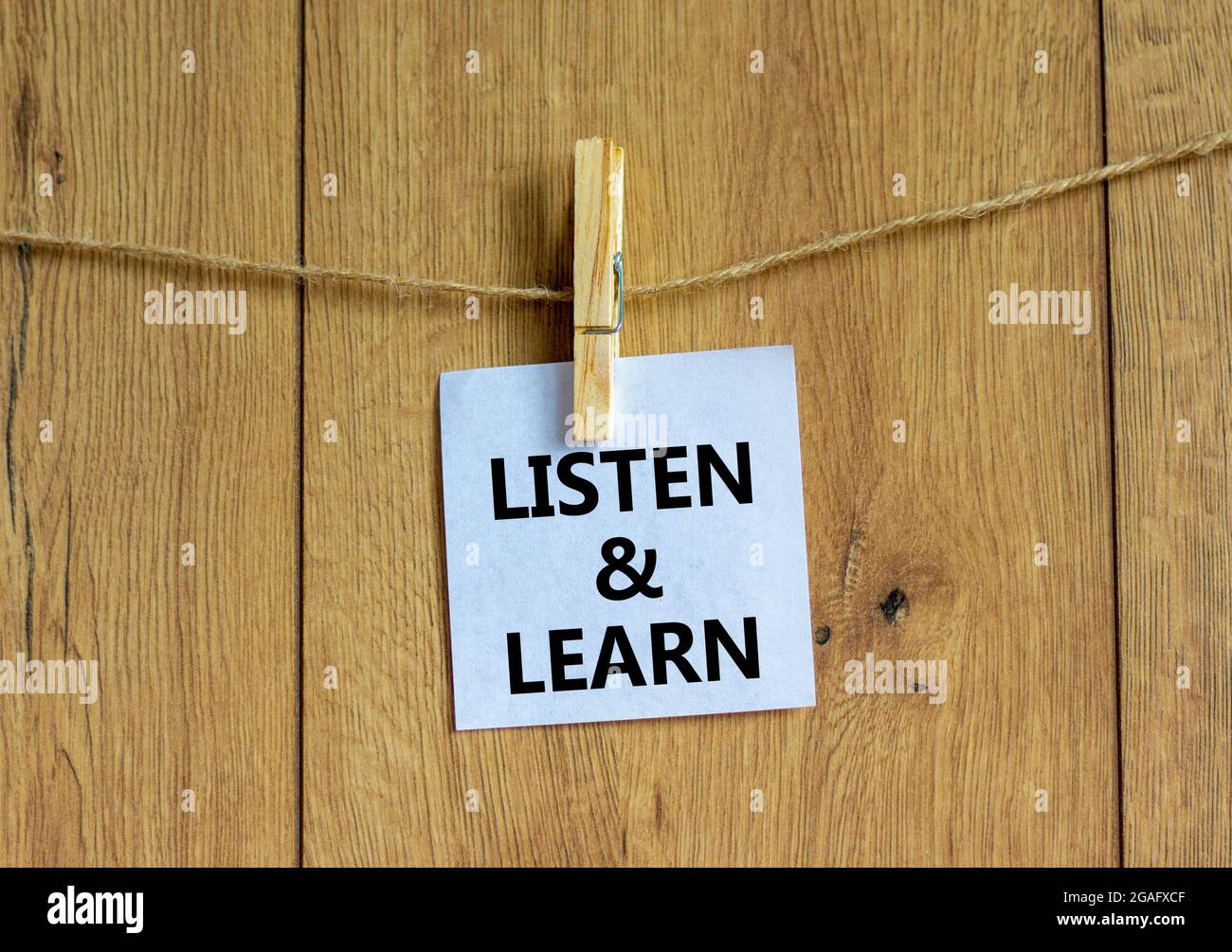 Listen and learn symbol. White paper with words 'Listen and learn ...