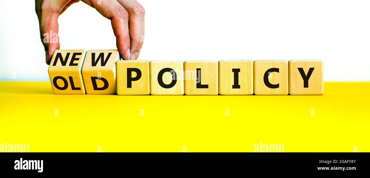 New or old policy symbol. Businessman turns wooden cubes and changes ...