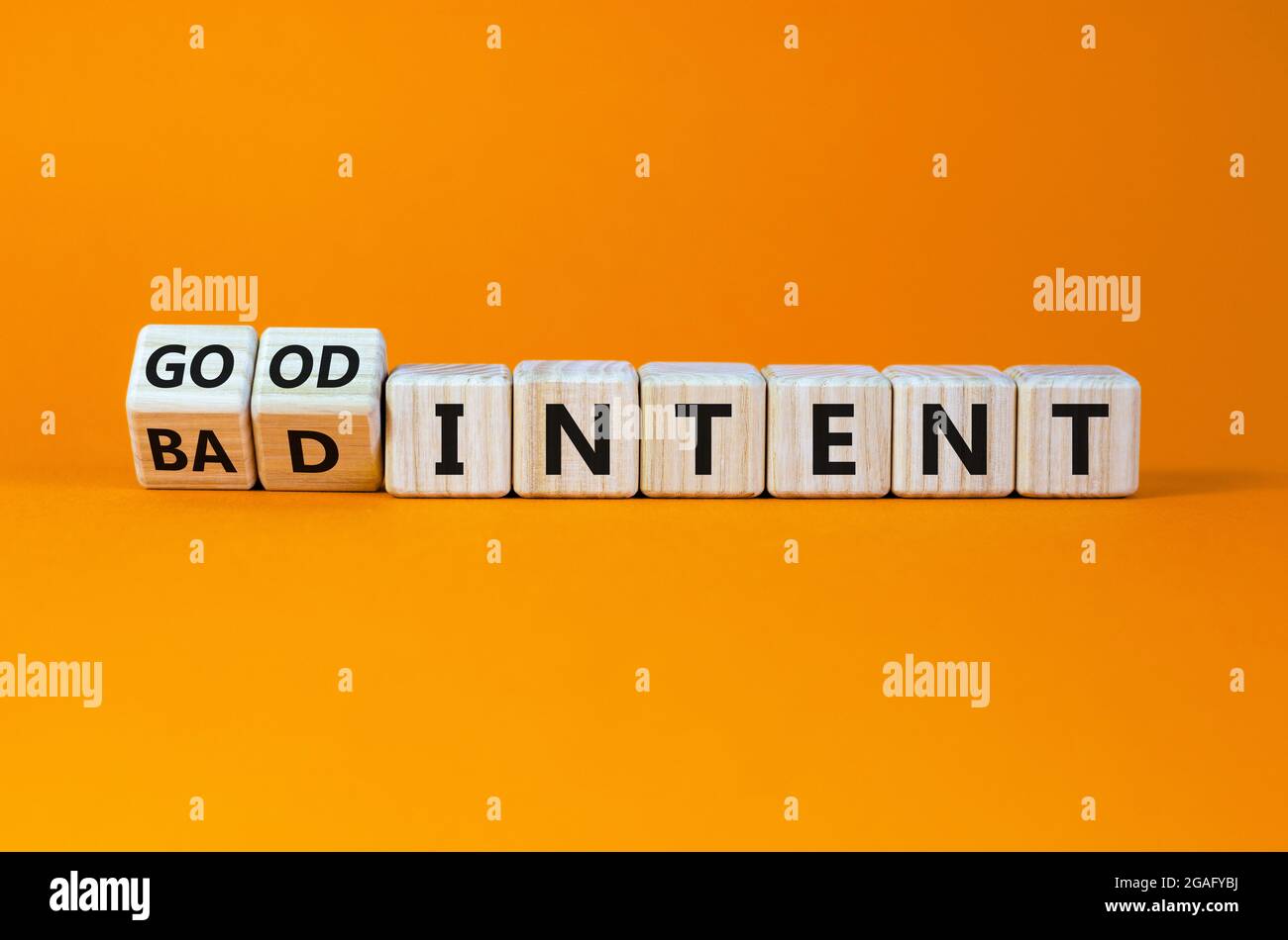 Good or bad intent symbol. Turned wooden cubes, changed words 'bad ...