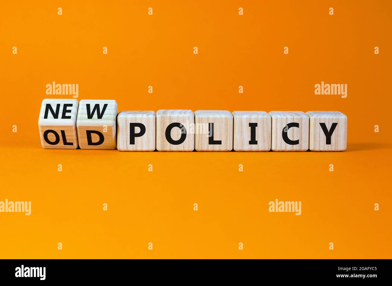 New or old policy symbol. Turned wooden cubes, changed words 'old ...