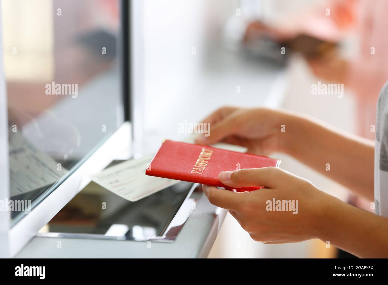 Airport Check-In Counters With Passengers Stock Photo - Alamy