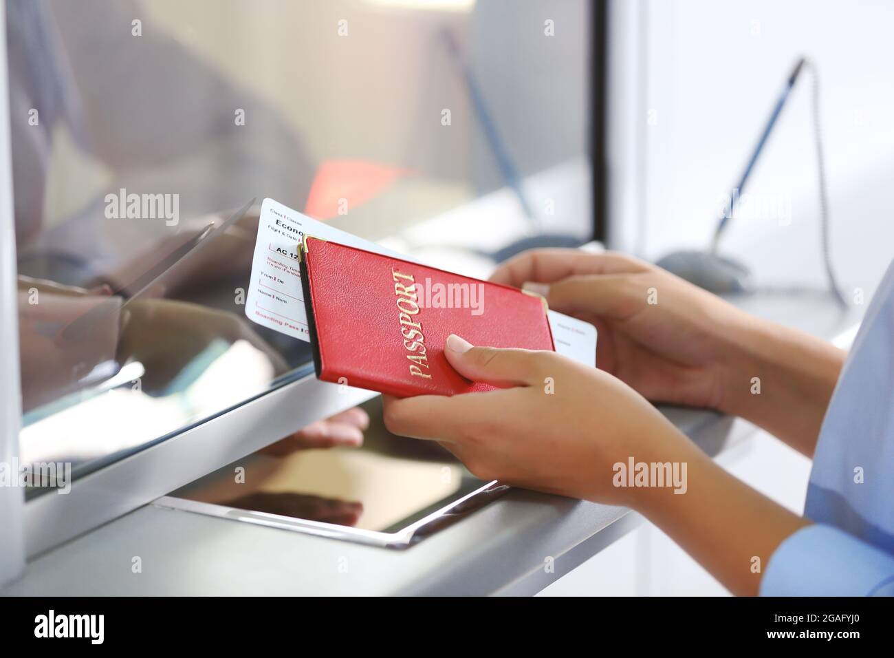 Airport Check-In Counters With Passengers Stock Photo - Alamy