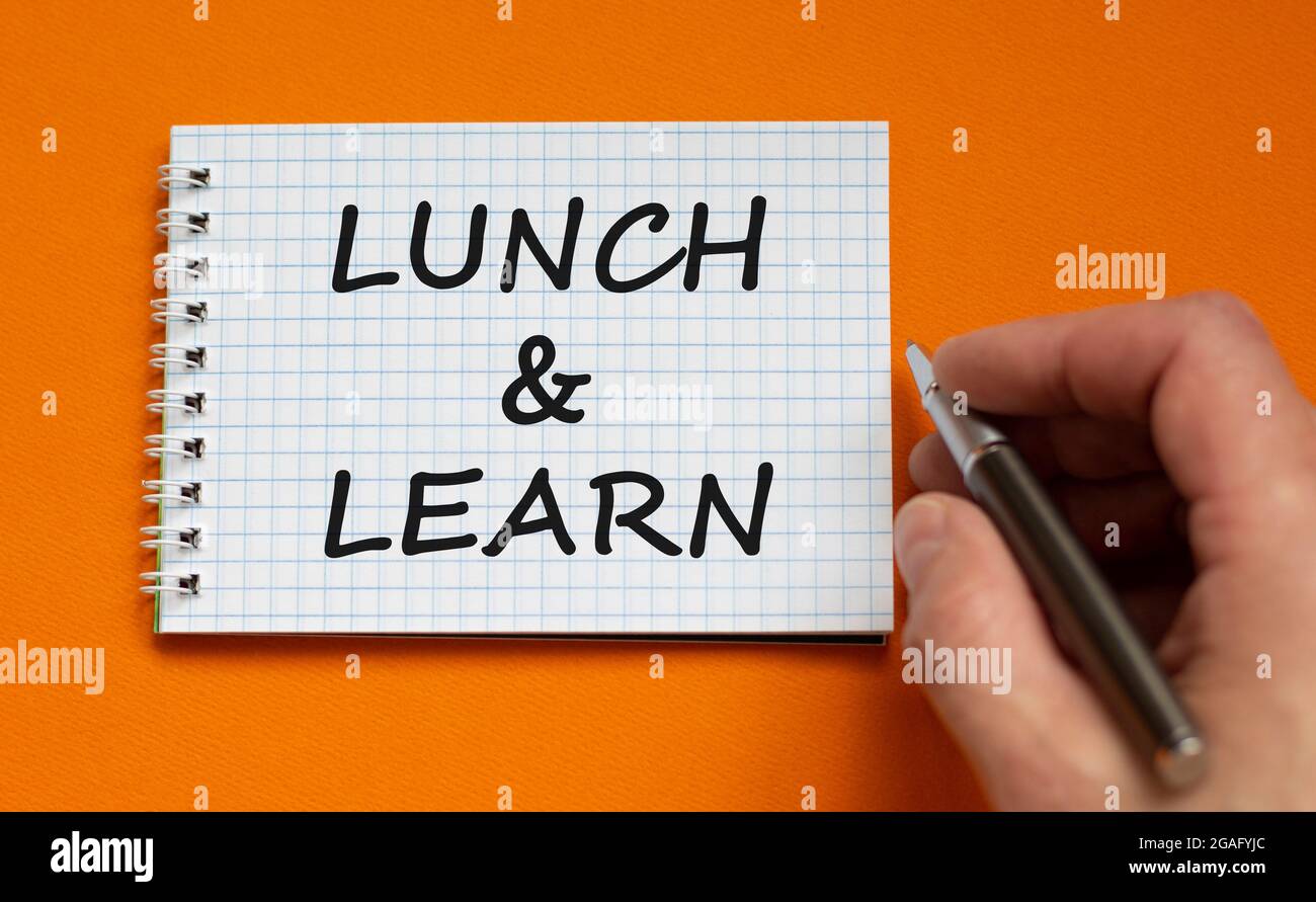 Lunch and learn symbol. Businessman writing words 'Lunch and learn' on ...