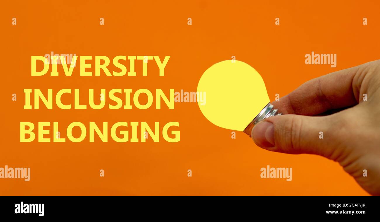 Diversity, inclusion, belonging symbol. Businessman holds yellow ...