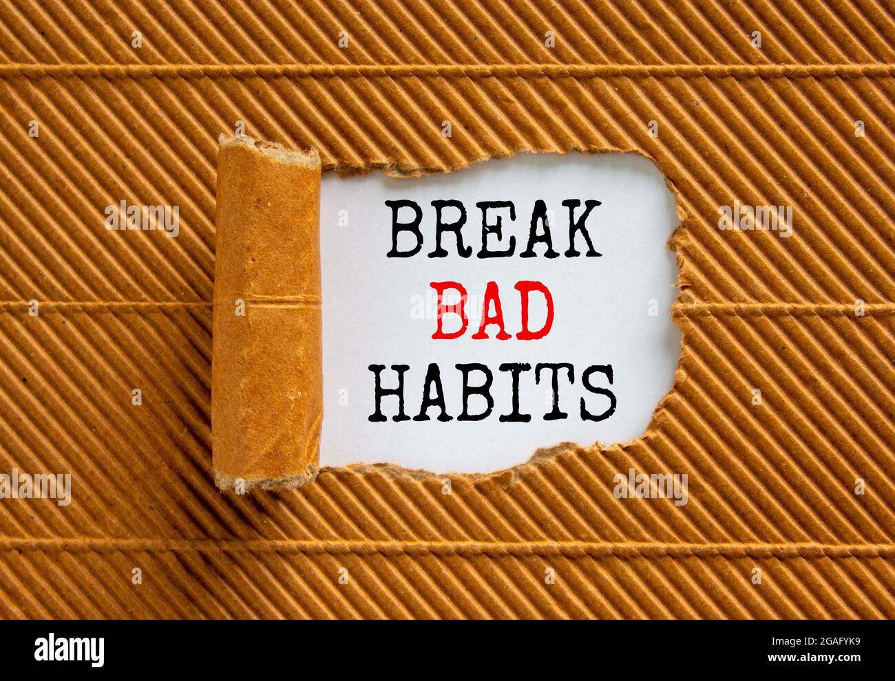 Break bad habits symbol. Words 'Break bad habits' appearing behind torn ...