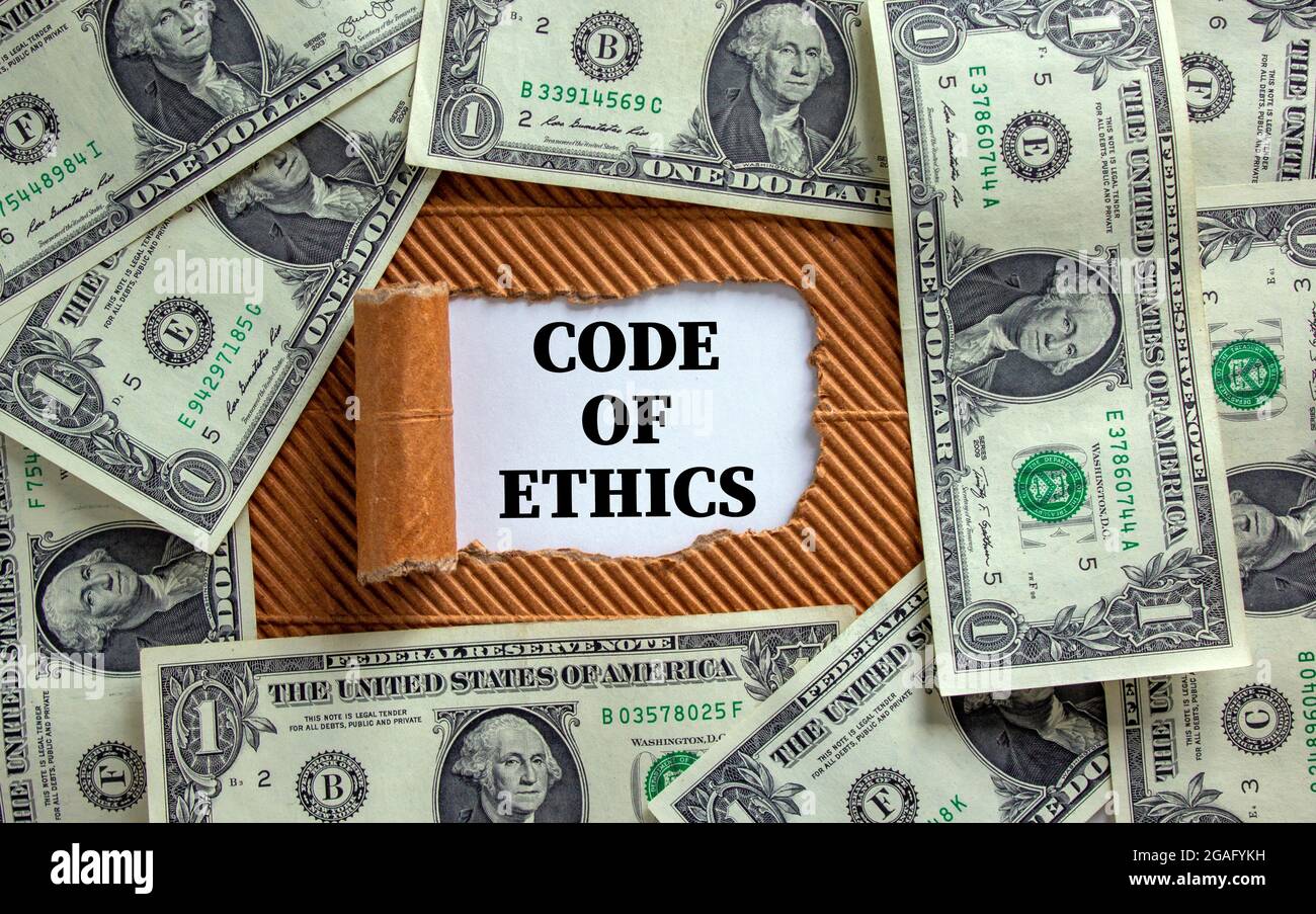 Code of ethics symbol. Words 'Code of ethics' appearing behind torn ...