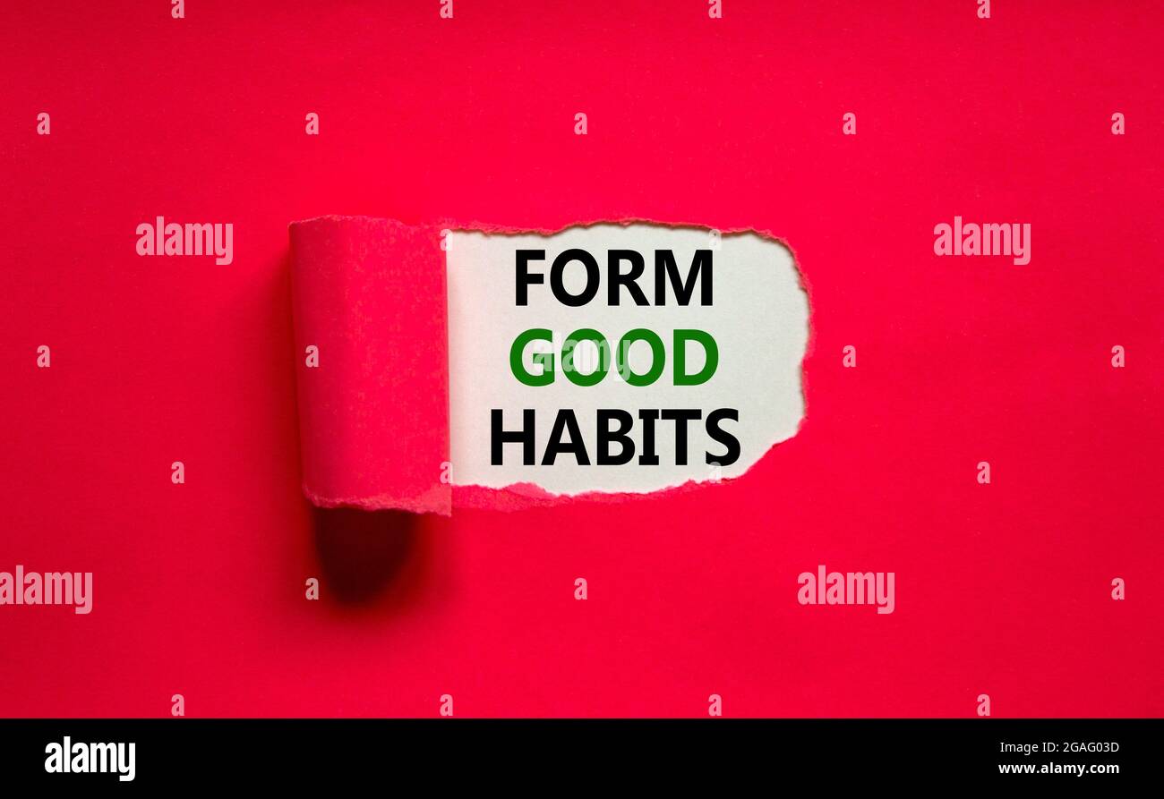 Form good habits symbol. Words 'Form good habits' appearing behind torn ...
