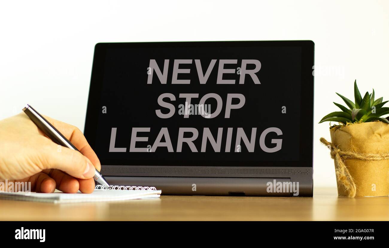Never stop learning symbol. Tablet with words 'Never stop learning ...