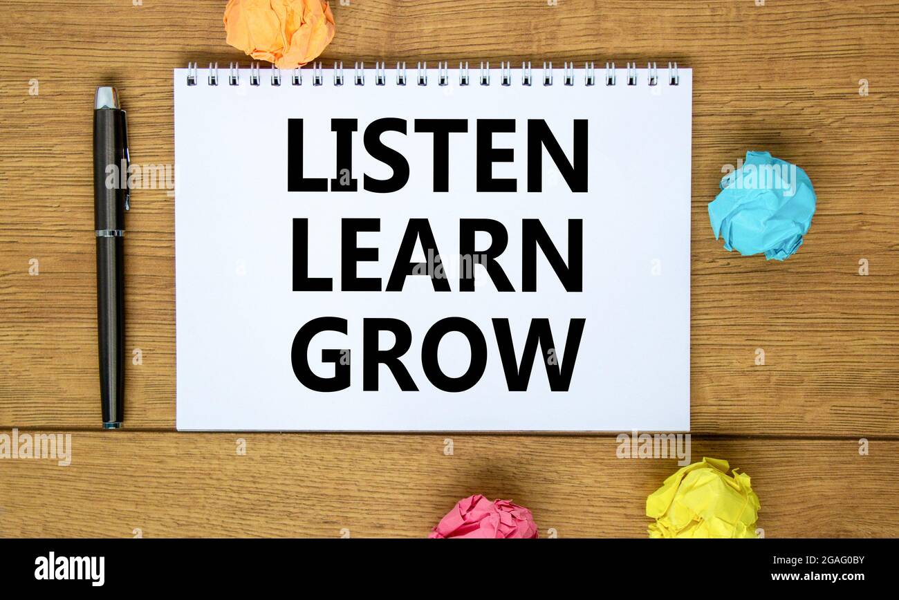 Listen, learn, grow symbol. Words 'Listen, learn, grow' on white note ...