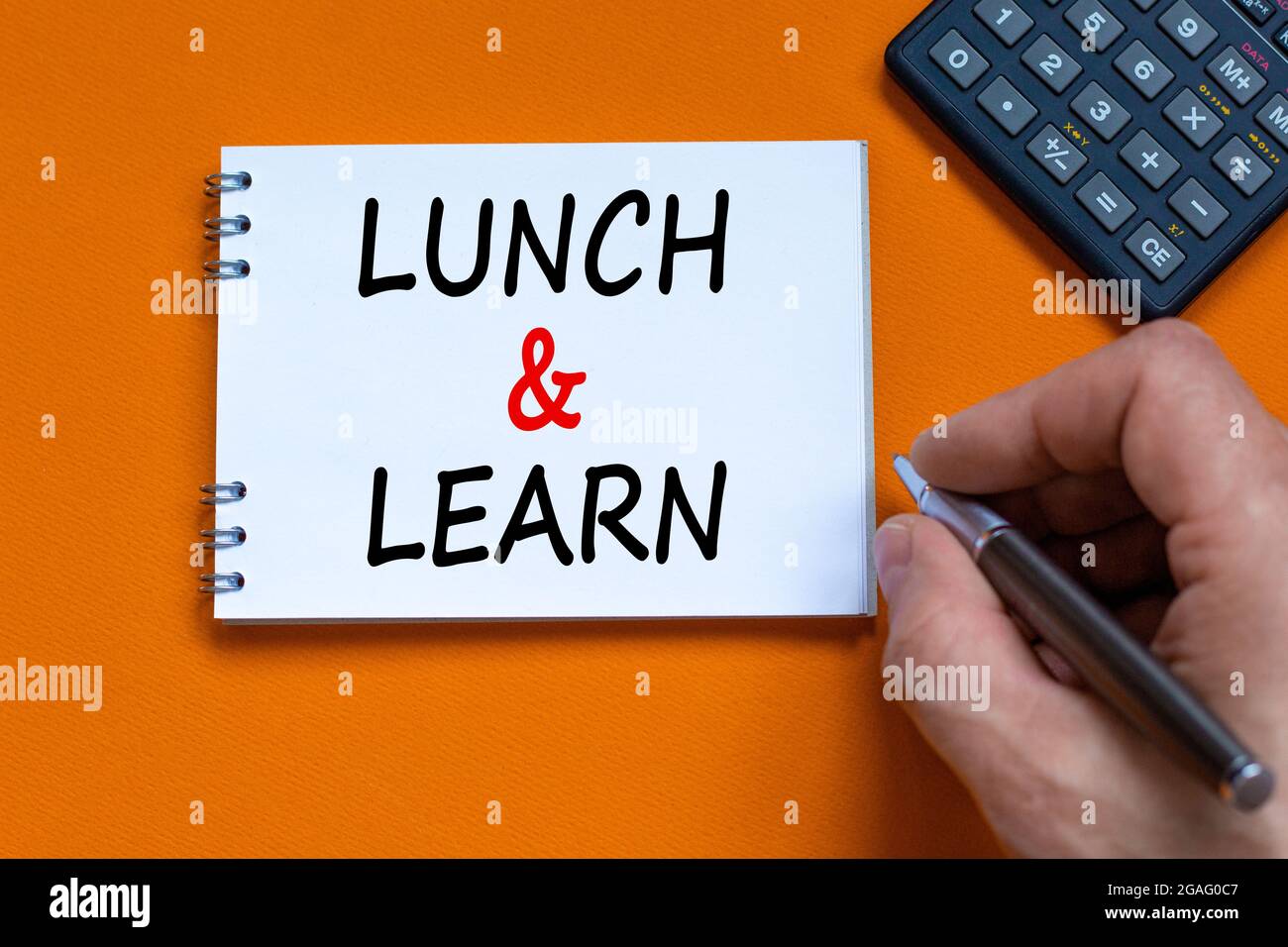 Lunch and learn symbol. Businessman writing words 'Lunch and learn' on ...