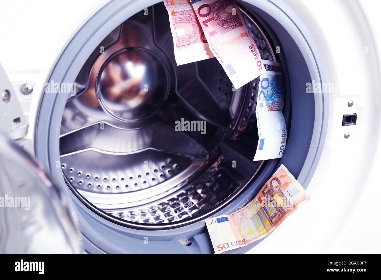 Money in washing machine, close up Stock Photo - Alamy