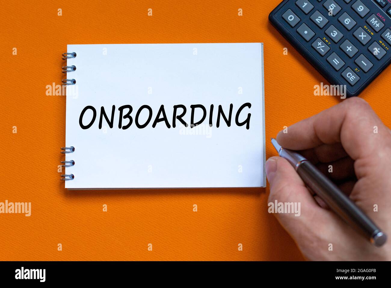 Onboarding symbol. Businessman writing the word Onboarding on white ...