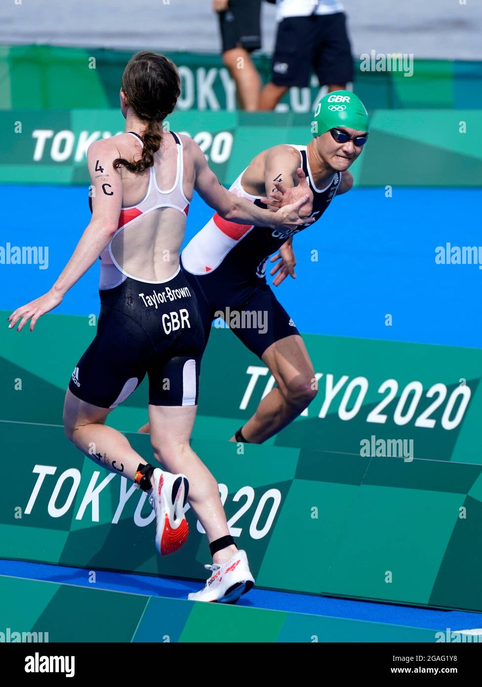 Great Britain's Georgia Taylor-Brown hands over to team-mate Alex Yee ...