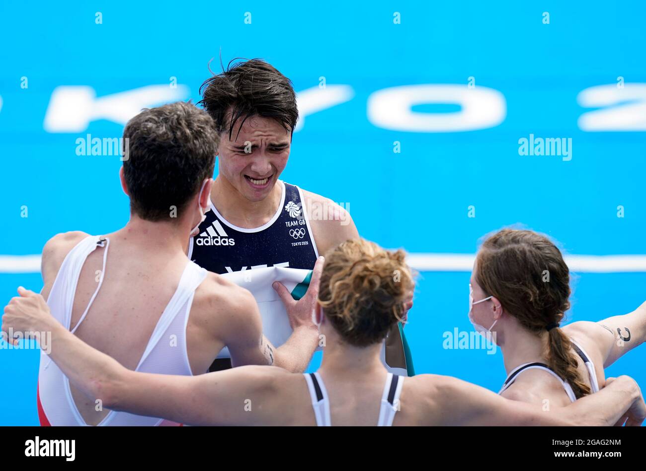 Great Britain's Alex Yee celebrates gold with team-mates in the ...