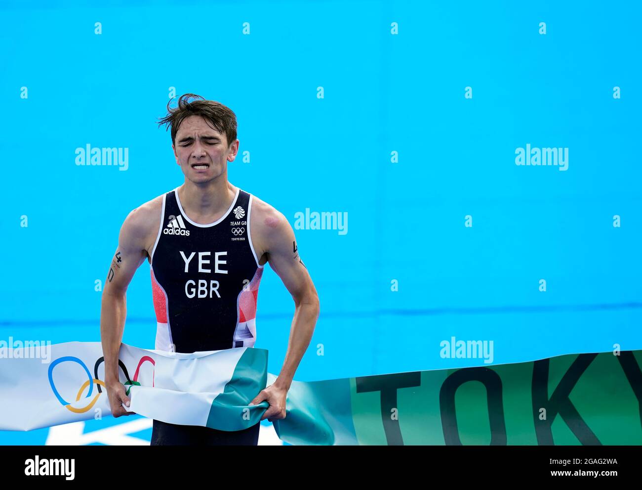 Great Britain's Alex Yee crosses the finish line in the Triathlon Mixed ...