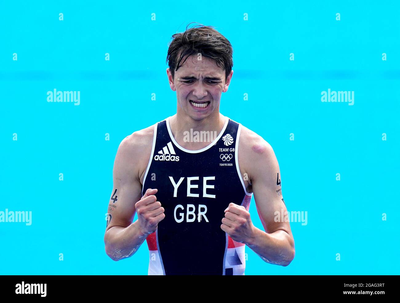 Great Britain's Alex Yee reacts as he crosses the finish line in the ...