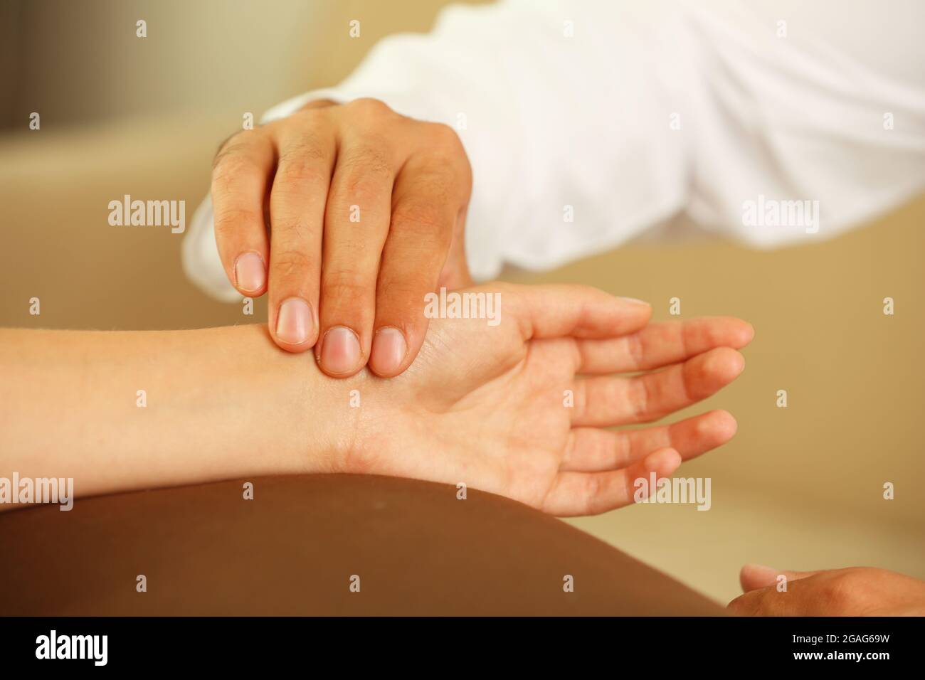 Checking pulse, close up Stock Photo - Alamy