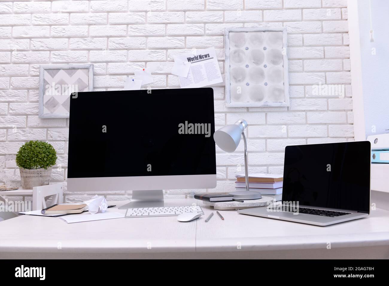 Workplace with computer and laptop on the table, close up Stock Photo ...