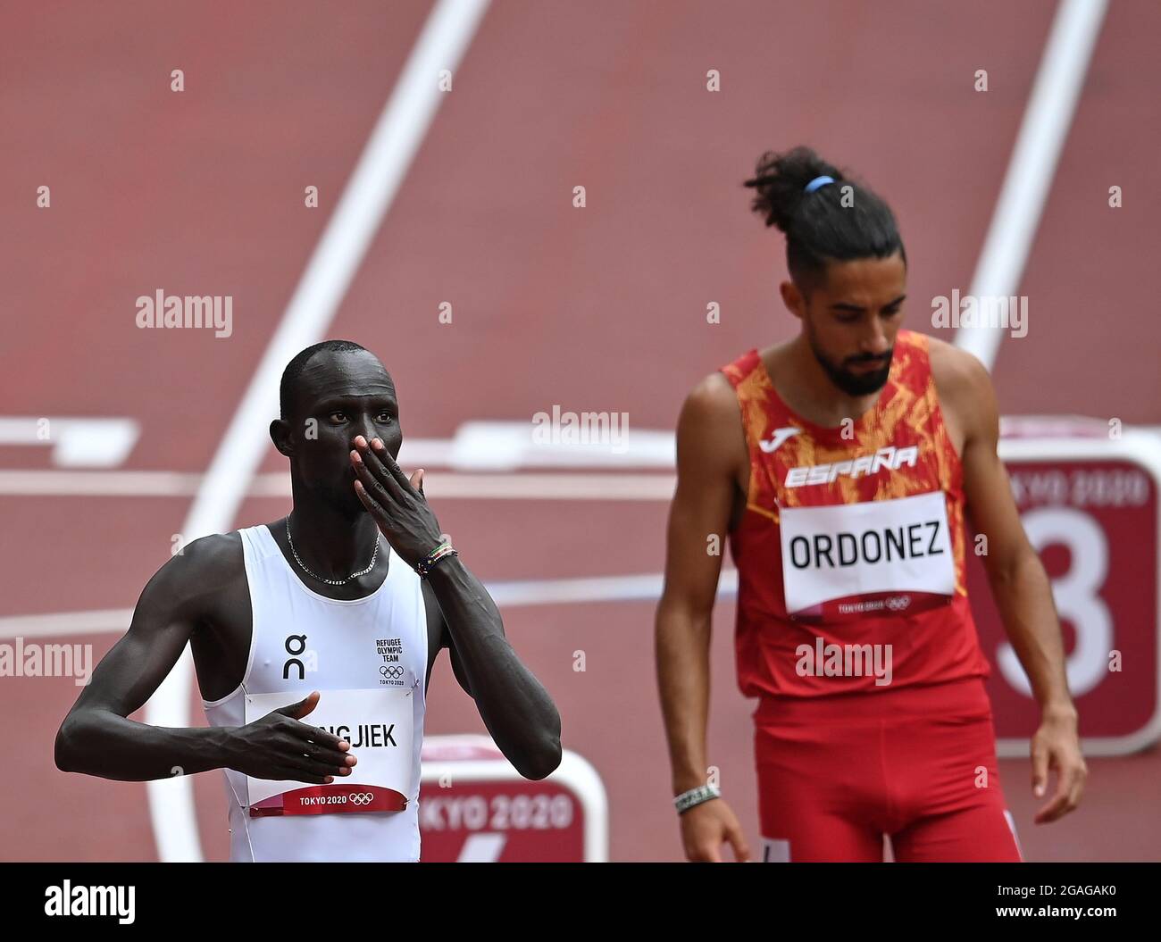 Tokyo, Japan. 31st July, 2021. James Nyang Chiengjiek (L) of the ...
