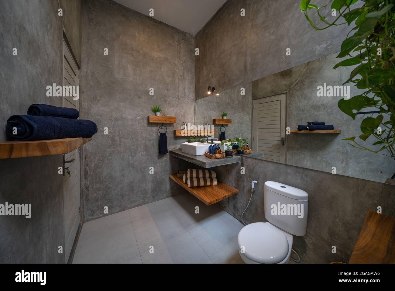 Interior of a modern bathroom. polished concrete style Stock Photo - Alamy