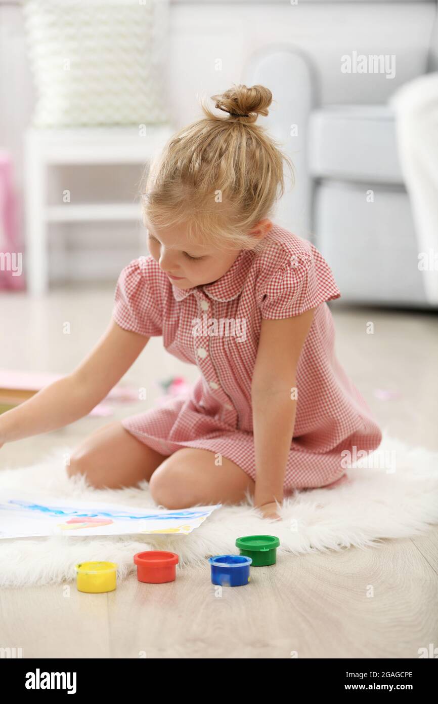 Little girl drawing in the room Stock Photo - Alamy