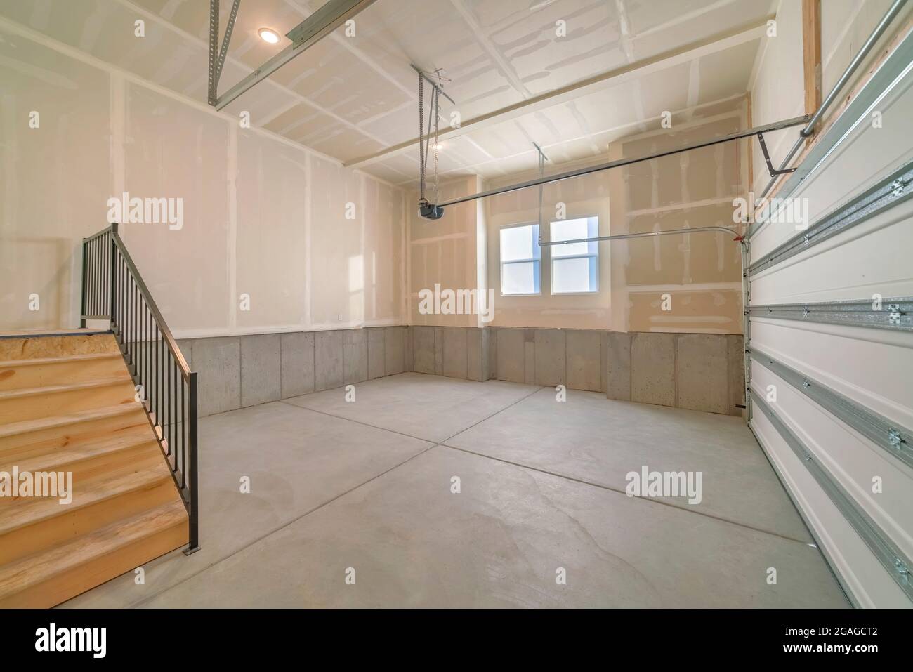 Empty garage interior with wooden stairs and windows Stock Photo - Alamy